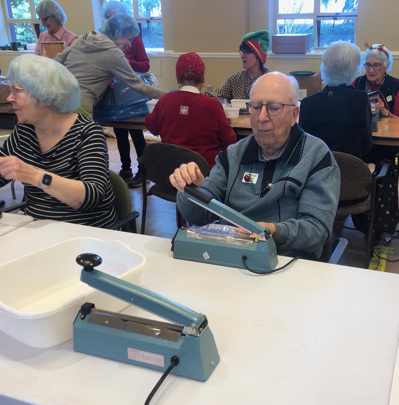 Mary’s Woods residents pack thousands of meals for those in need | Lake ...